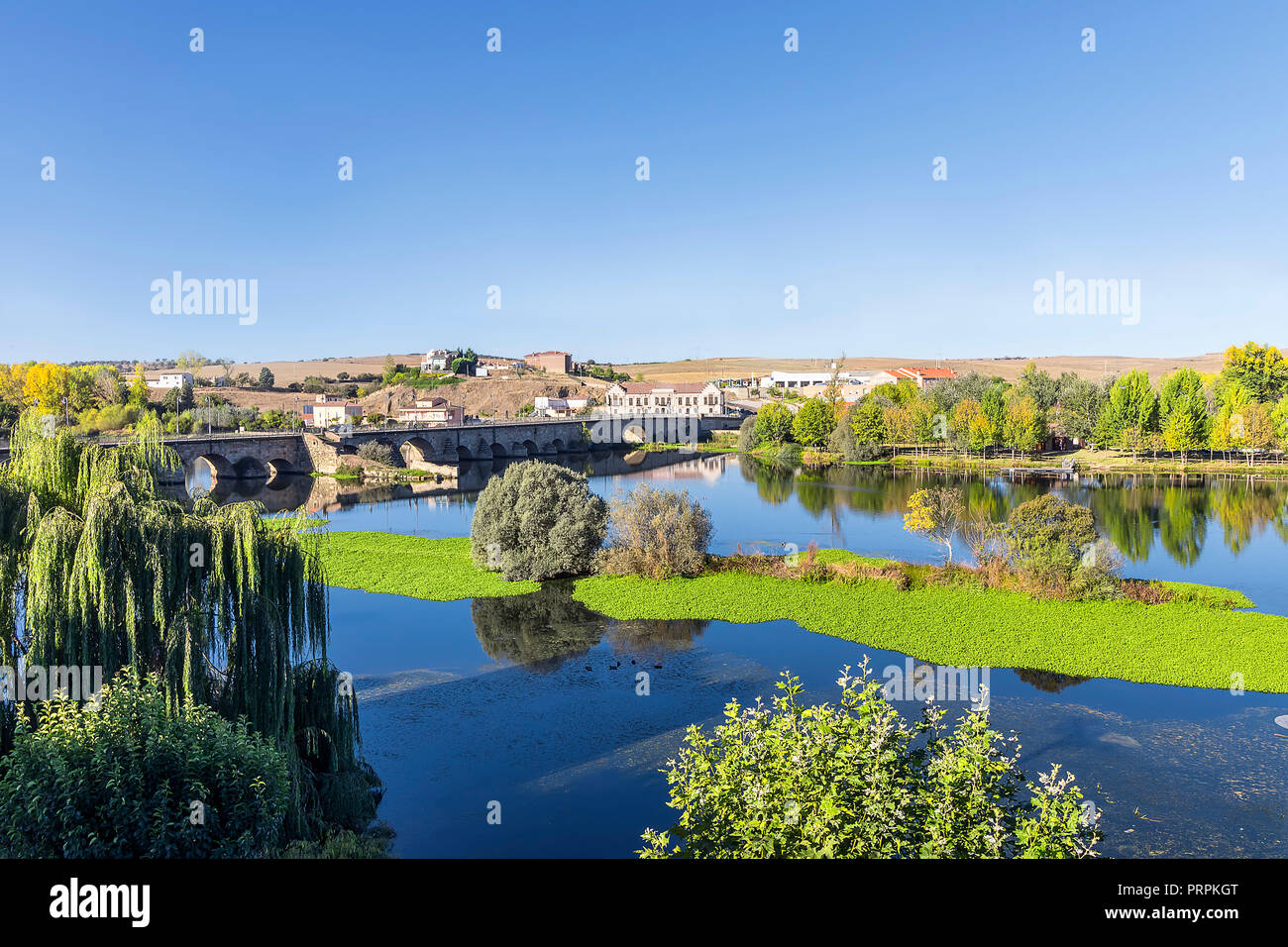 The Roman bridge over the Tormes river and its folliage in the ducal ...