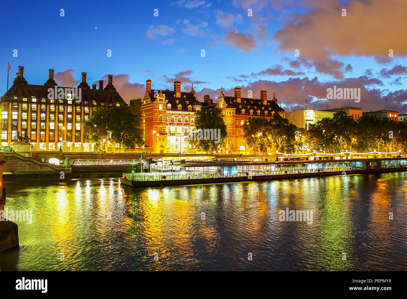 Night photo of westminster pier in Thames river, London, United Kingdom ...