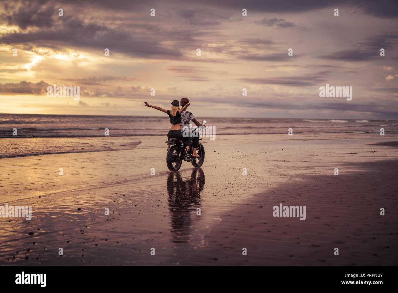 Woman riding on back motorcycle hi-res stock photography and images - Alamy