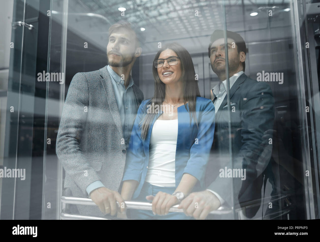 Business team group going on elevator Stock Photo - Alamy