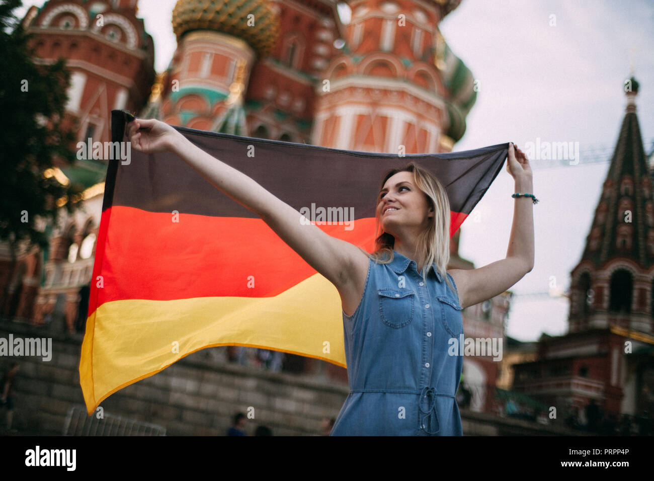 German girl in Russia. German waving a flag Stock Photo - Alamy