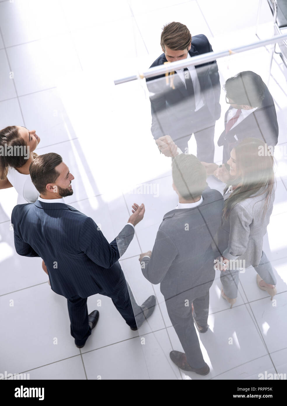 top view. colleagues are talking in the hall Stock Photo - Alamy