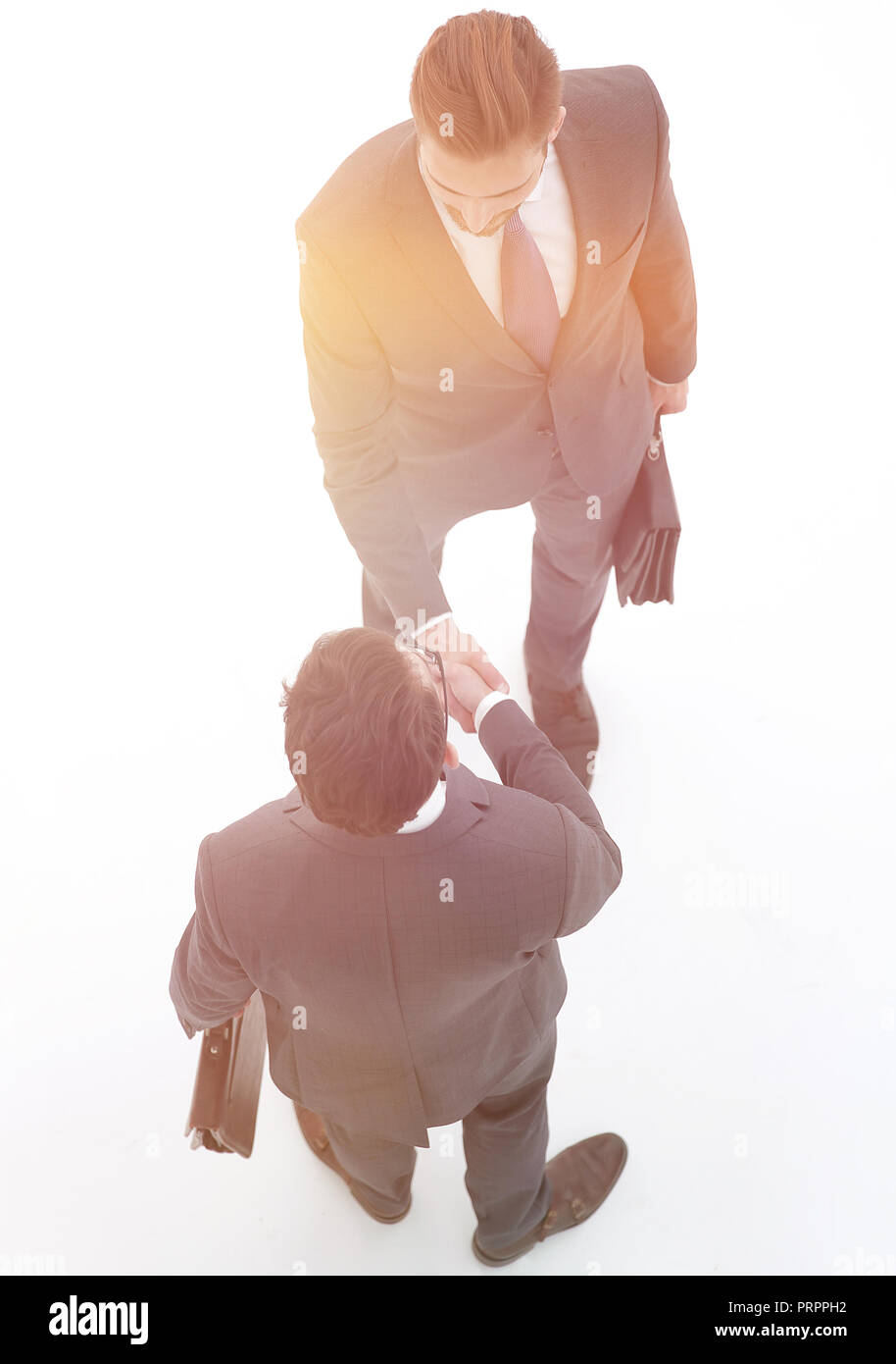 top view.the handshake business partners.isolated on white Stock Photo ...