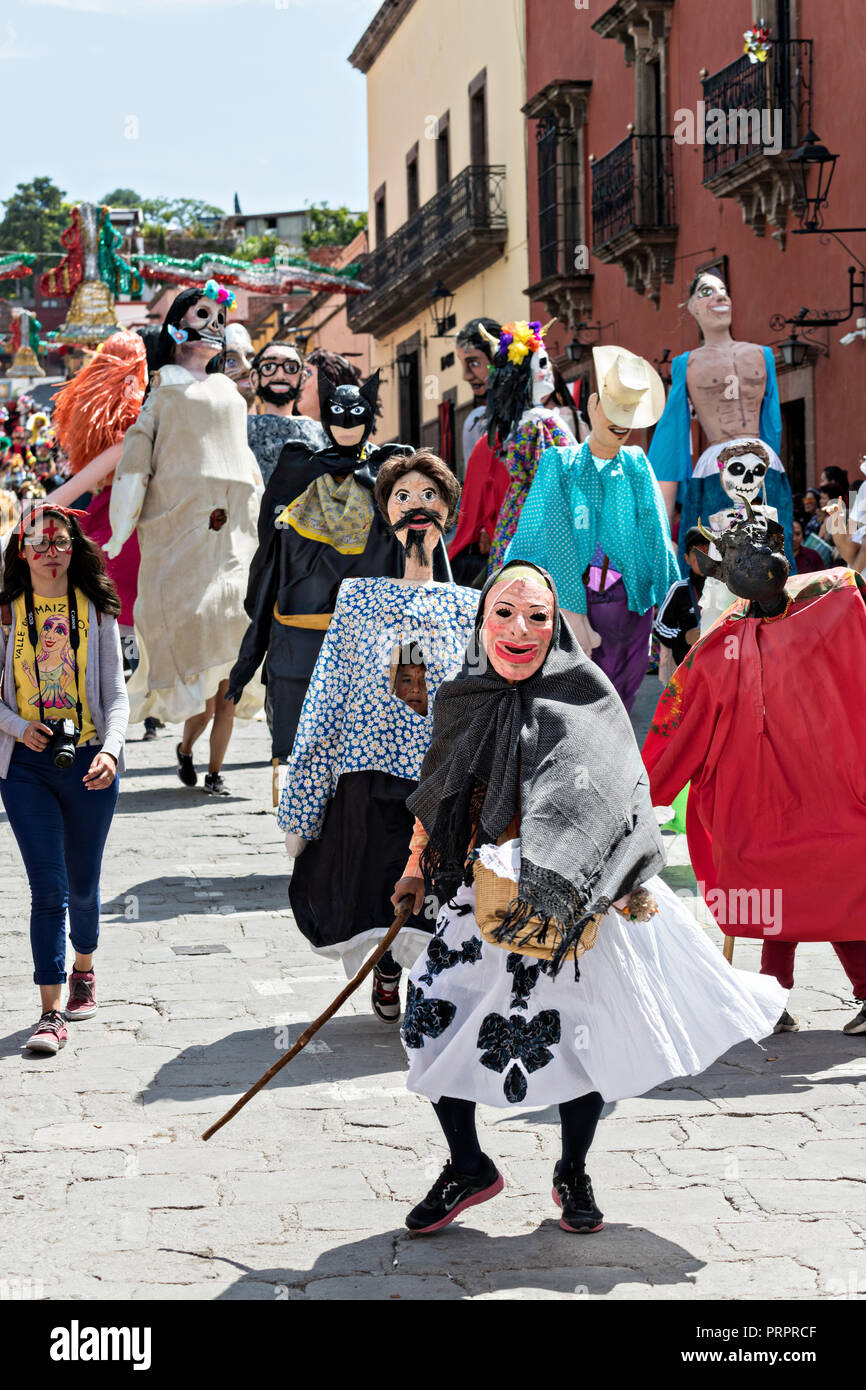 Giant paper-mache puppets called Mojigangas participate in the annual ...