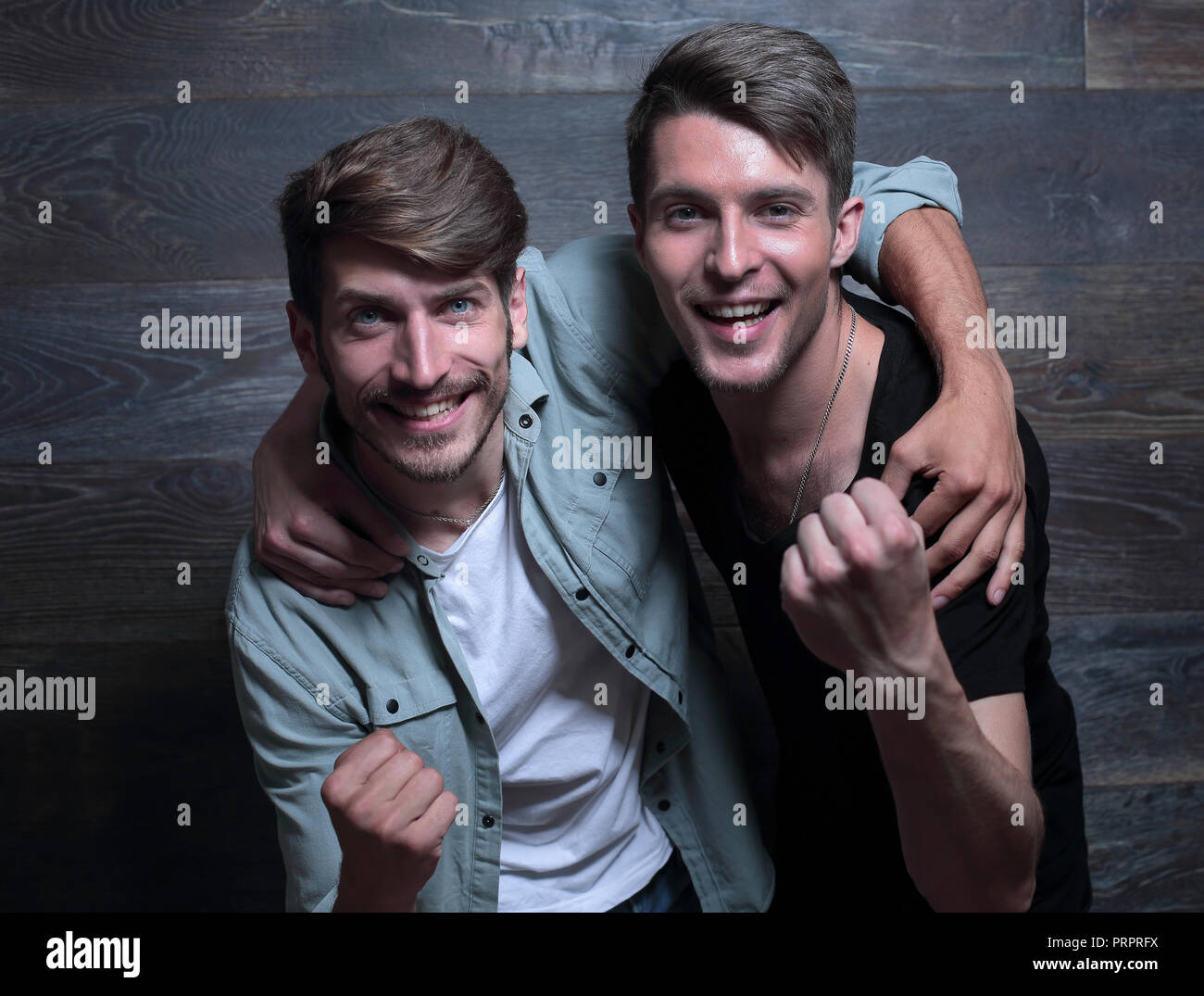 Two cheerful young students handsome hi-res stock photography and ...
