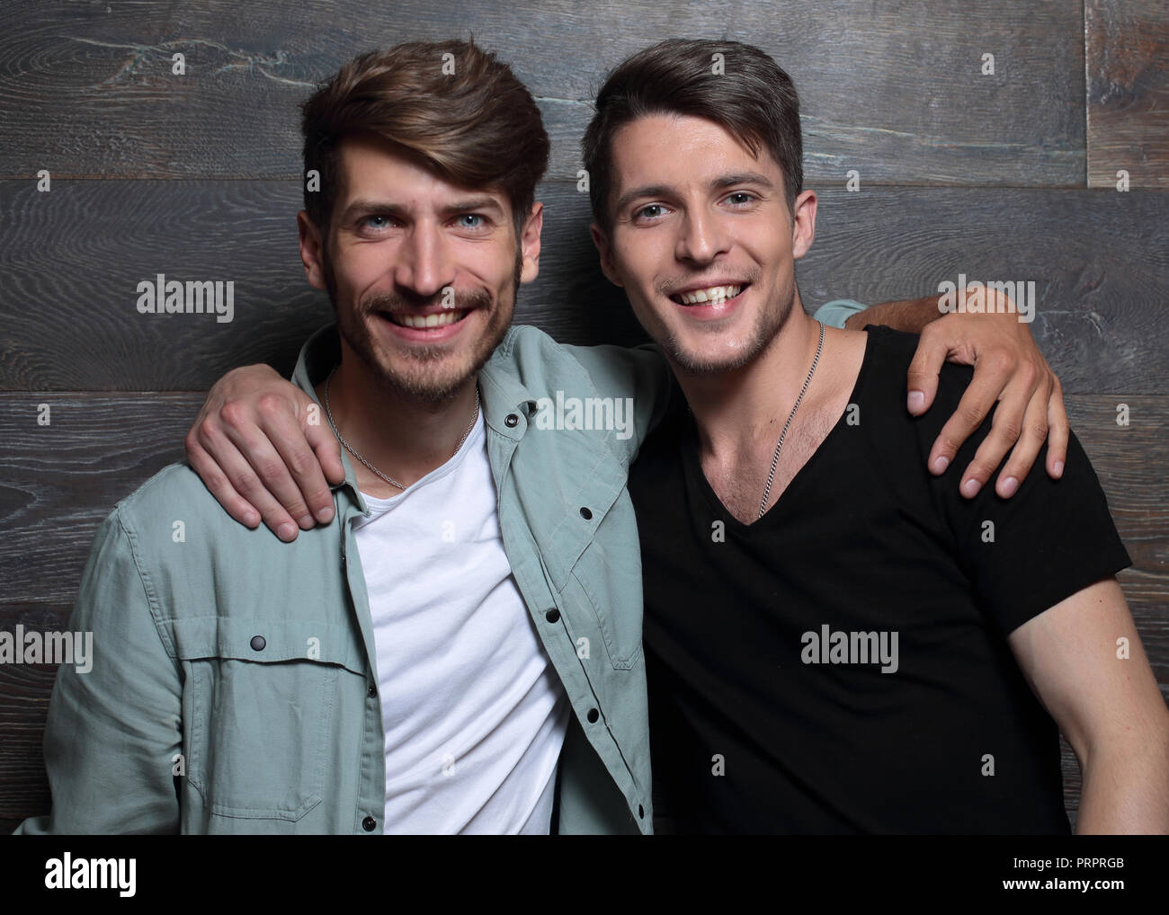 Two cheerful young students handsome hi-res stock photography and ...