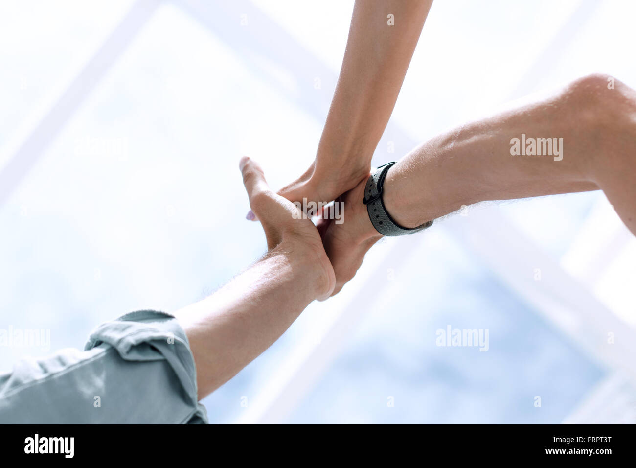 colleagues congratulating coworker with business success clapping hands ...
