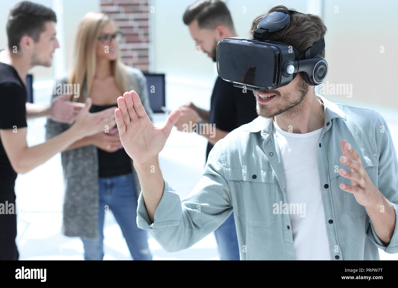 Young men with virtual reality goggles Stock Photo - Alamy