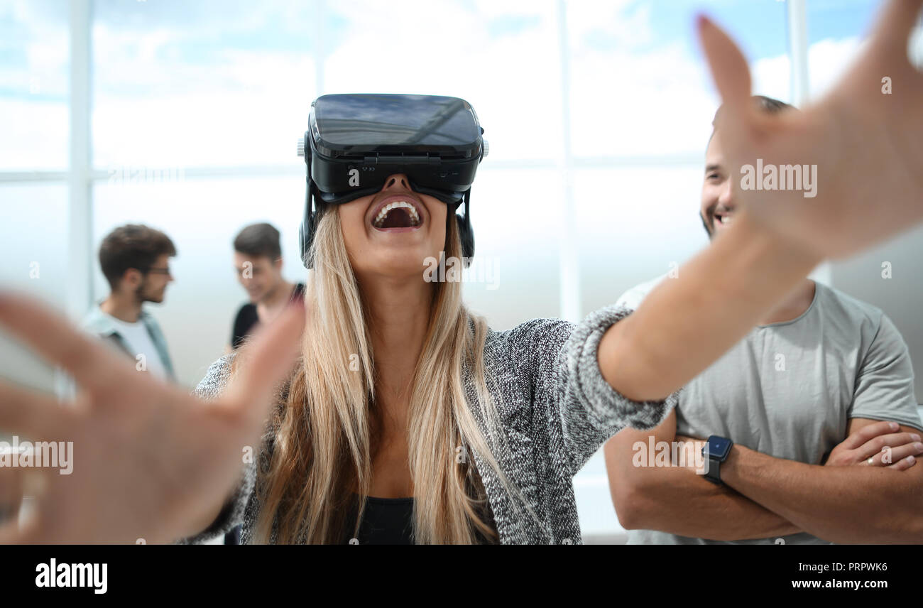 Girl in VR glasses of virtual reality with gamepad playing game Stock ...