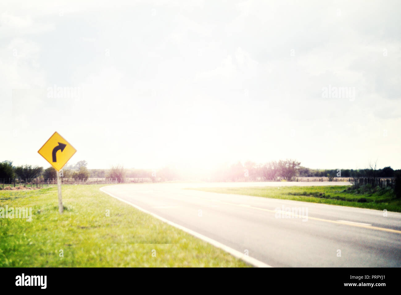 Curve sign traffic, sign black arrow on yellow background Stock Photo ...