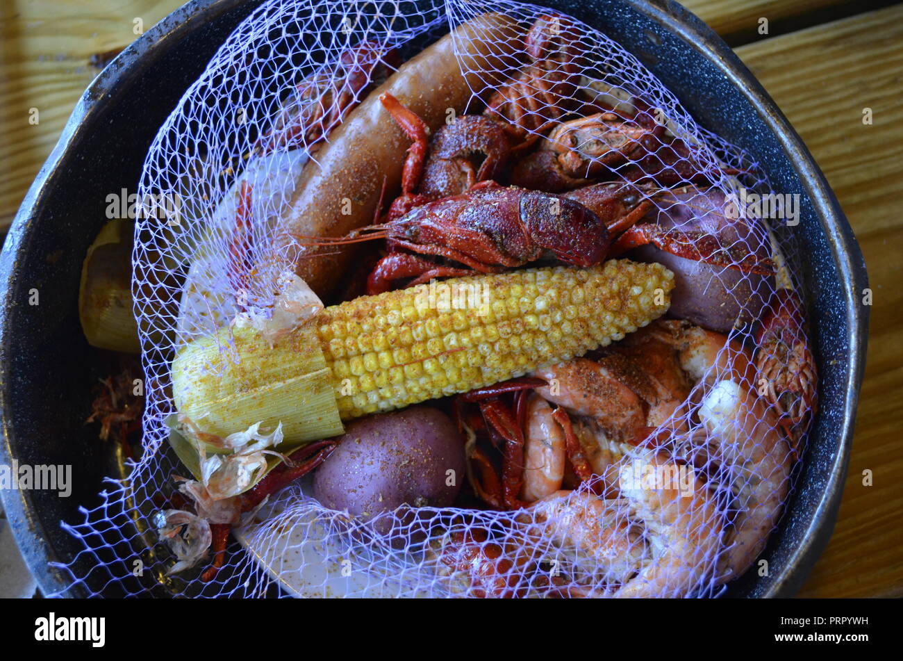 Crawfish boil for dinner Stock Photo - Alamy