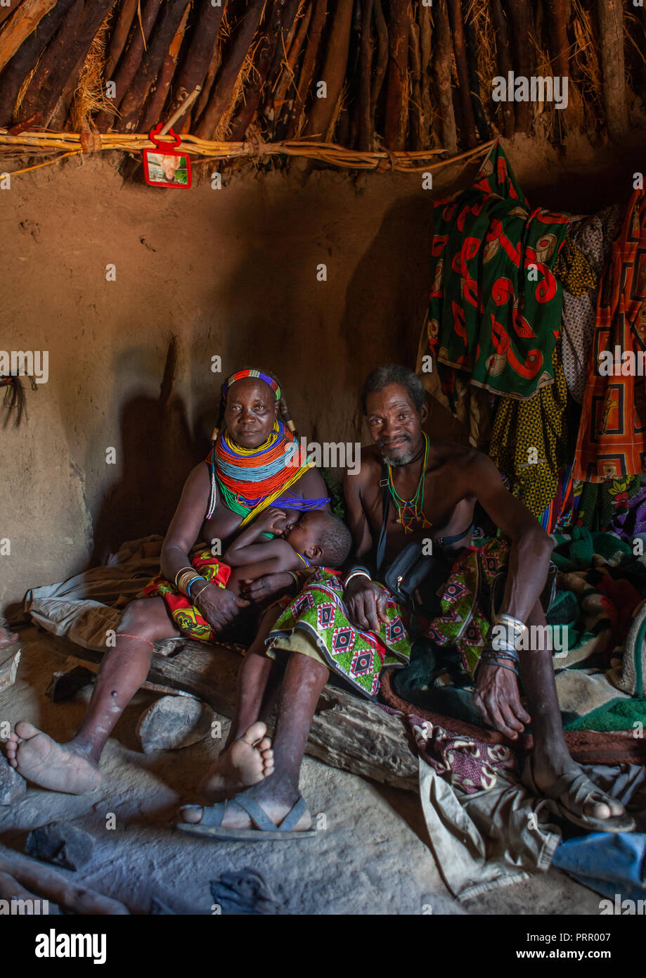 Mumuhuila tribe family inside their hut, Huila Province, Chibia, Angola ...
