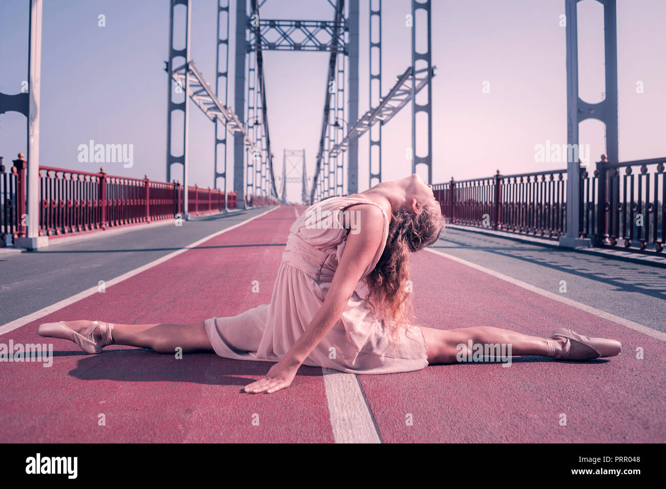 Attractive nice young woman feeling her dance Stock Photo - Alamy
