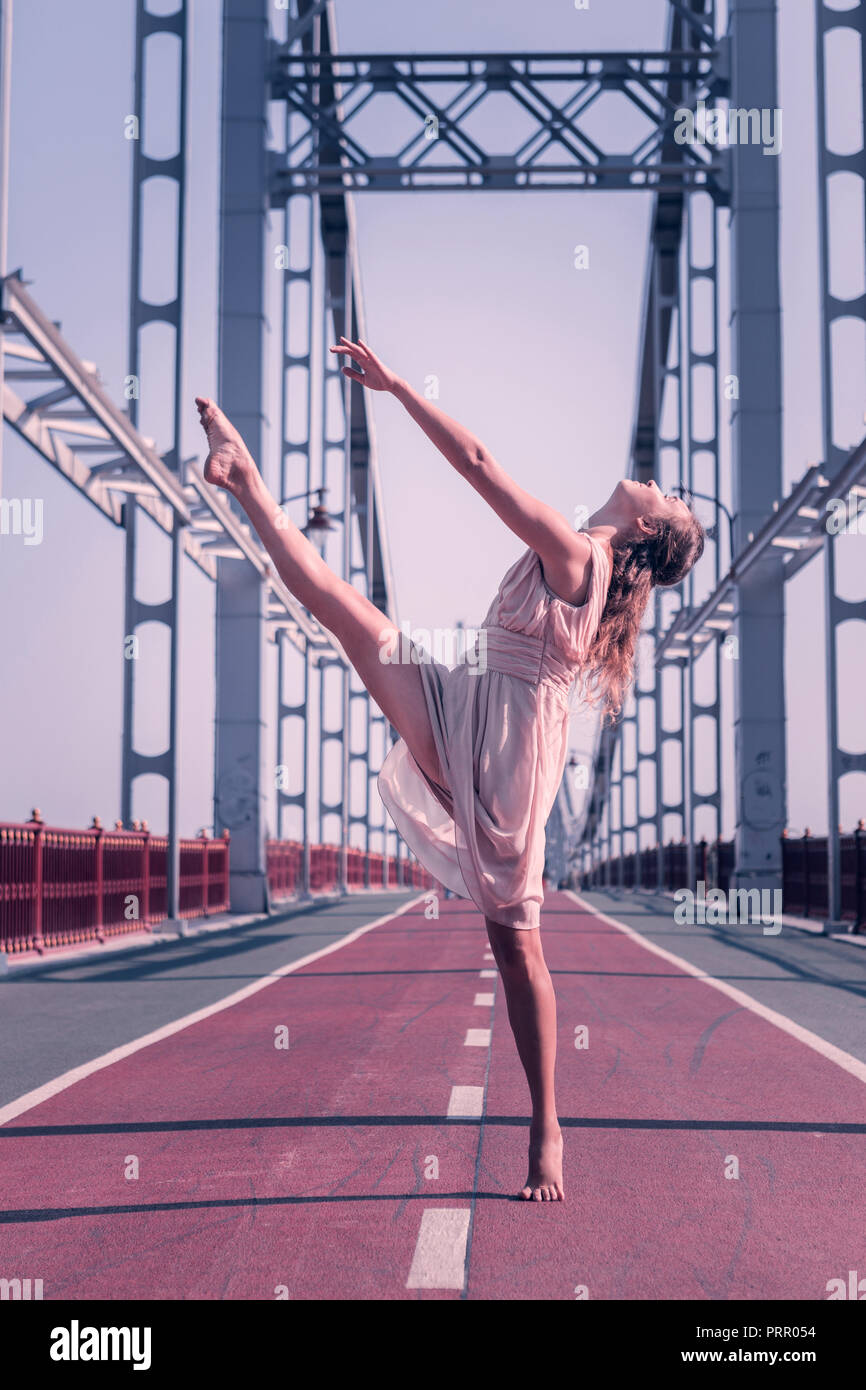 Nice young woman showing her dancing skills Stock Photo - Alamy