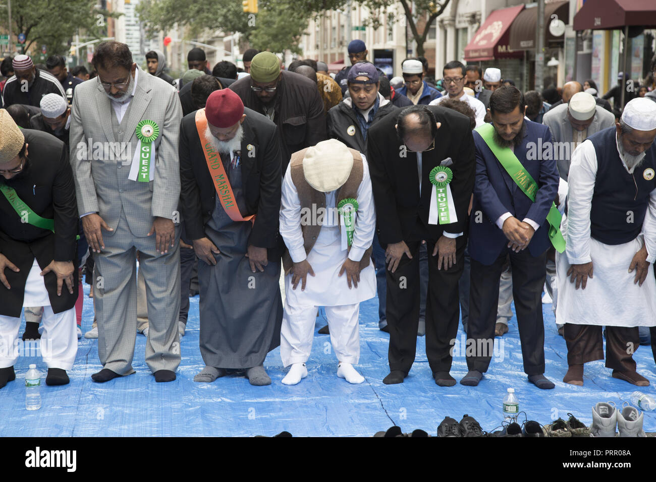 Diverse group of Muslim men pray on Madison Avenue before the annual ...