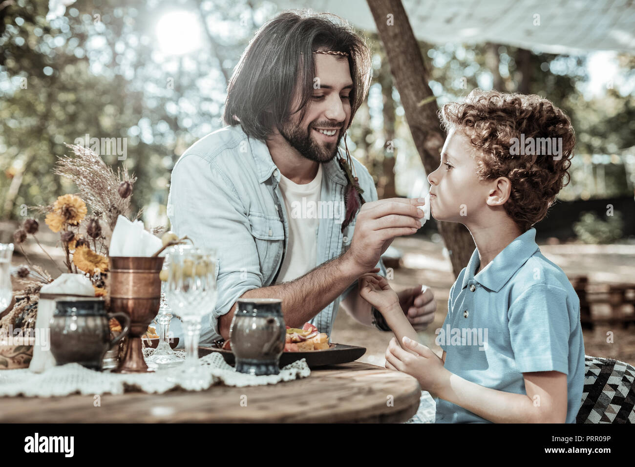 Pleasant bearded father washing his sons face Stock Photo - Alamy
