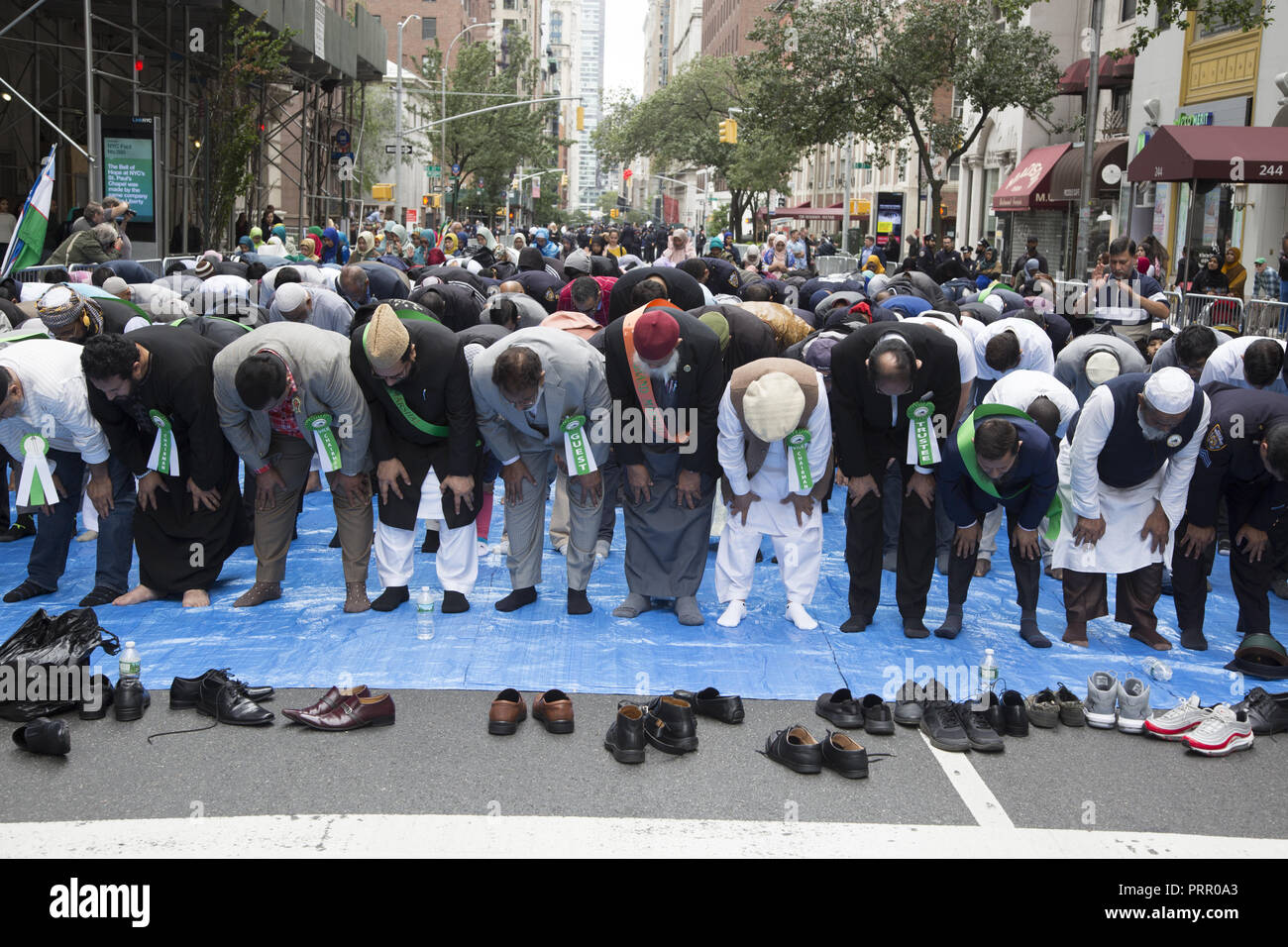 Diverse group of Muslim men pray on Madison Avenue before the annual ...