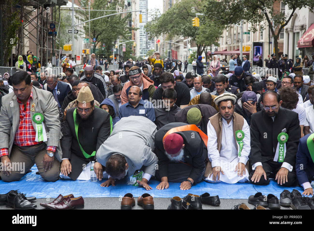 Diverse group of Muslim men pray on Madison Avenue before the annual ...