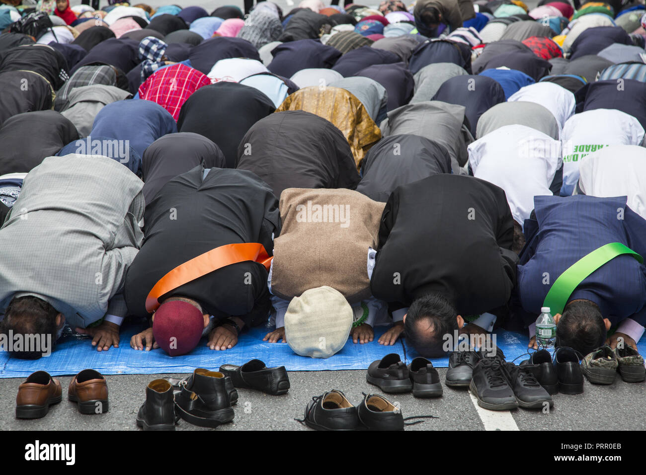 Diverse group of Muslim men pray on Madison Avenue before the annual ...