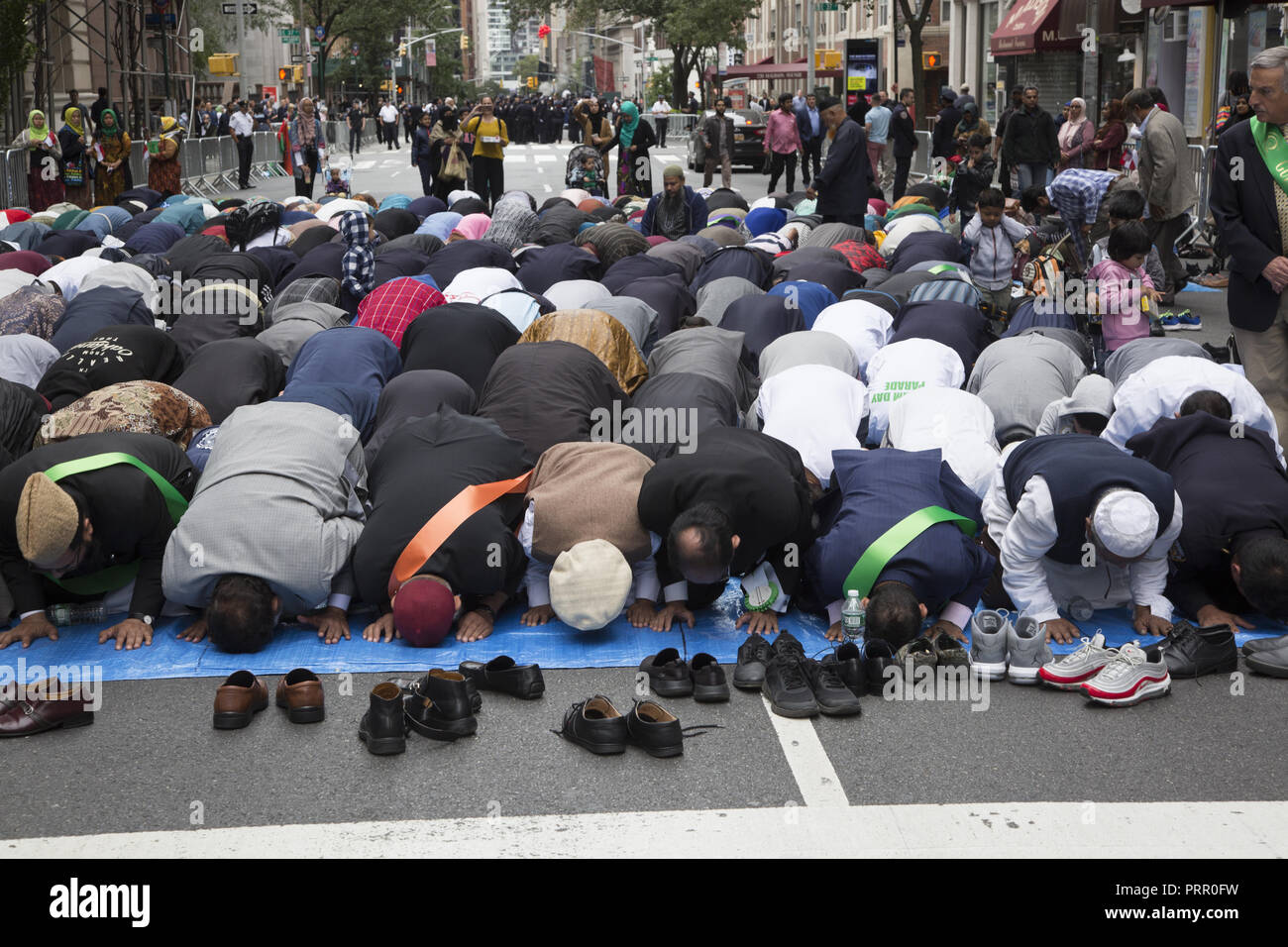 Diverse group of Muslim men pray on Madison Avenue before the annual ...