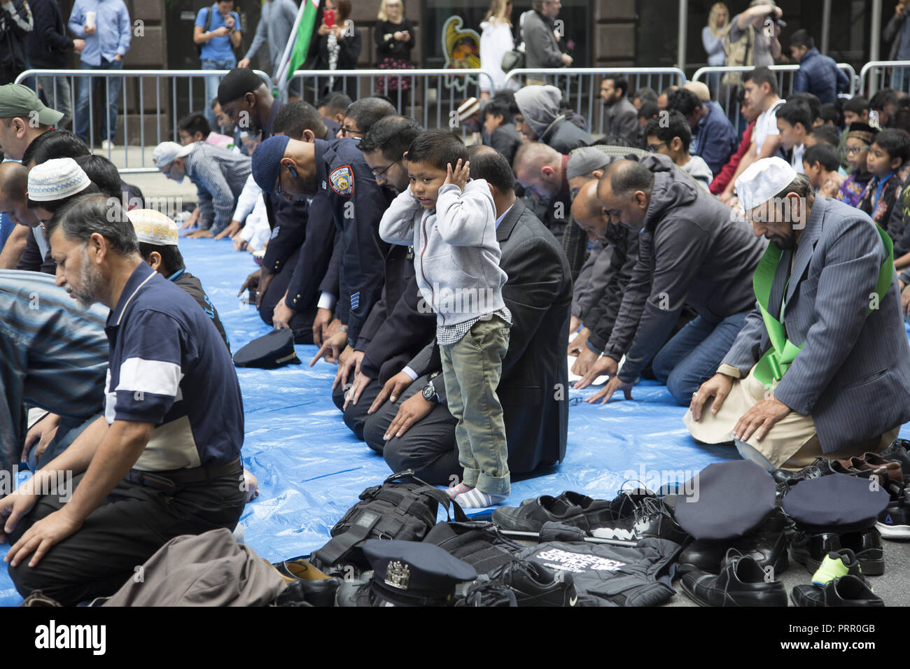 Diverse group of Muslim men pray on Madison Avenue before the annual ...