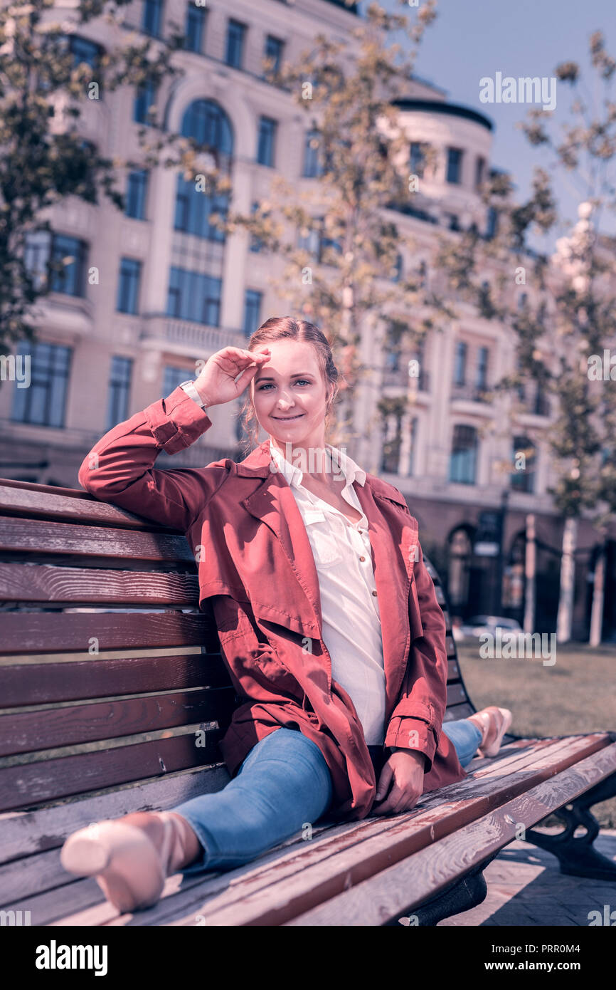 Joyful nice woman doing the splits on the bench Stock Photo - Alamy