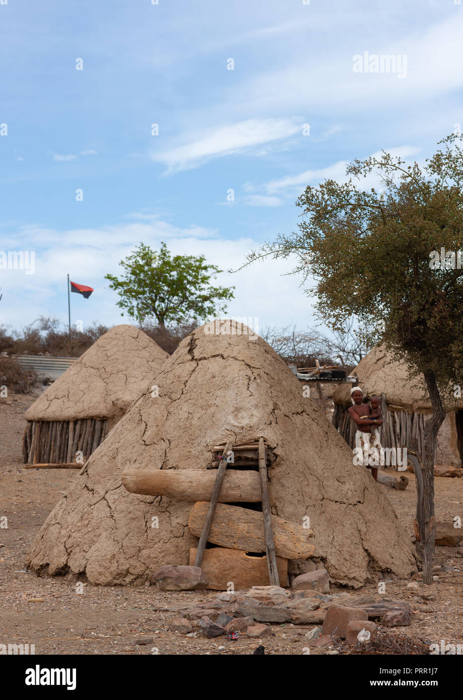 Mud huts in a traditional mucubal tribe village, Namibe Province, Virei ...