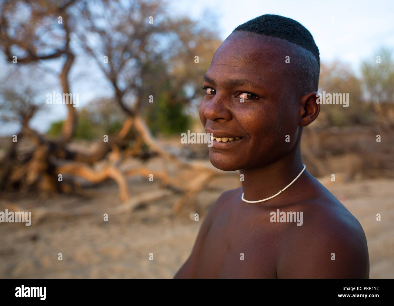 Portrait of a smiling mucubal tribe man, Namibe Province, Virei, Angola ...