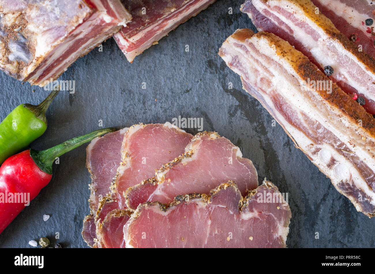 Varied dry meat. View from above. Meat and spices. Dark mood Stock ...