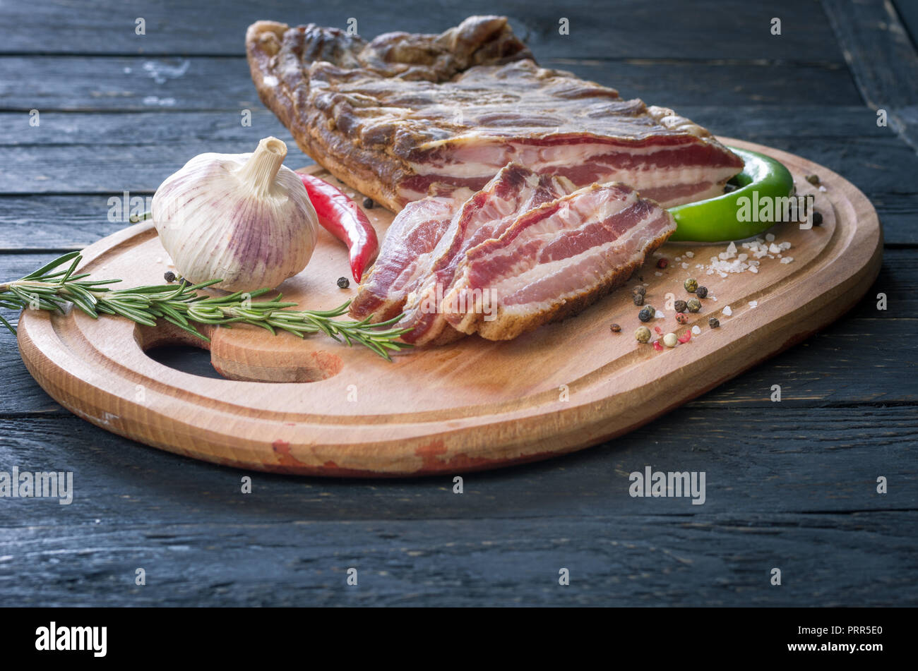 Sliced meat on the kitchen board. Meat snack. Front view Stock Photo ...