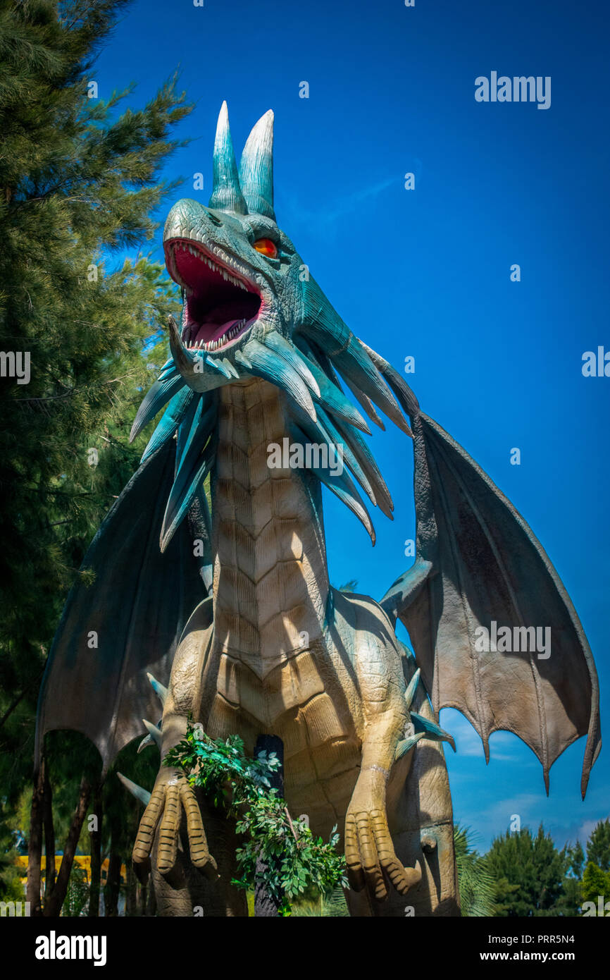 Angry blue dragon model Stock Photo - Alamy