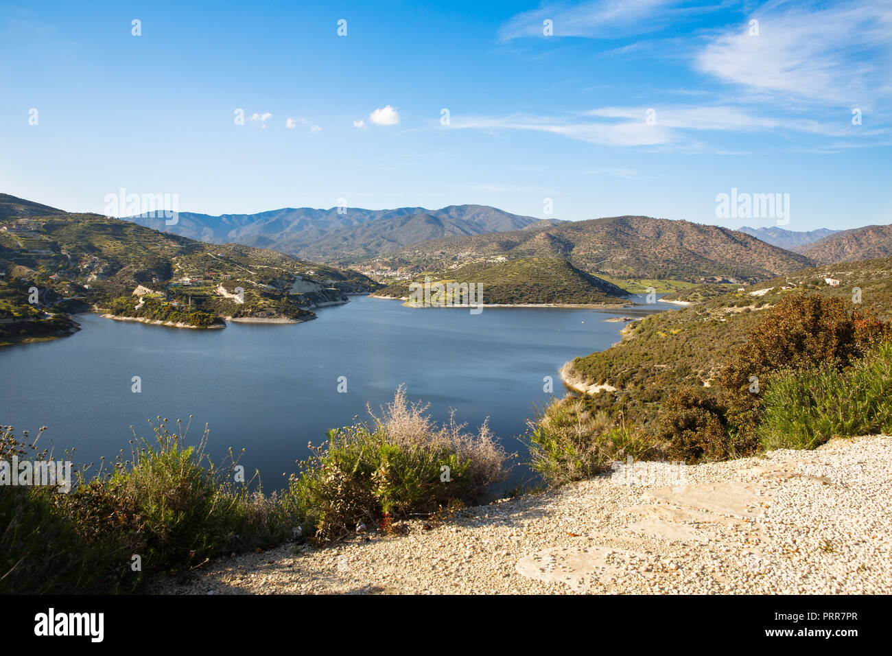 Cyprus landscape with mountains, lake and village Stock Photo - Alamy