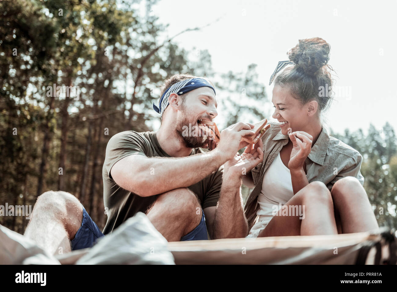 Loving caring girlfriend and boyfriend feeding each other while having ...