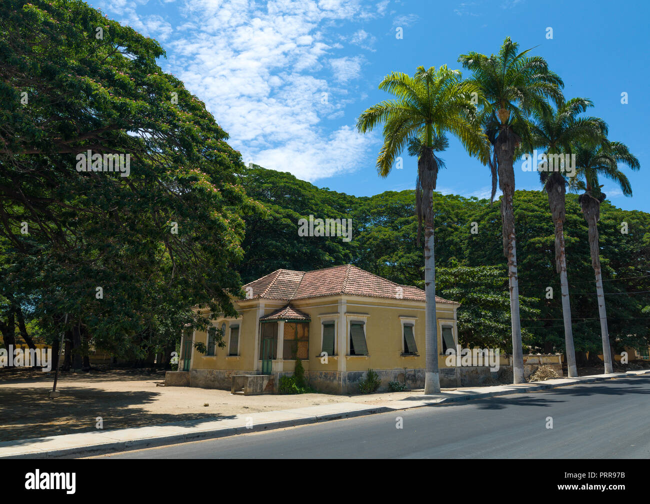 Old portuguese colonial house with palm trees, Namibe Province, Namibe ...