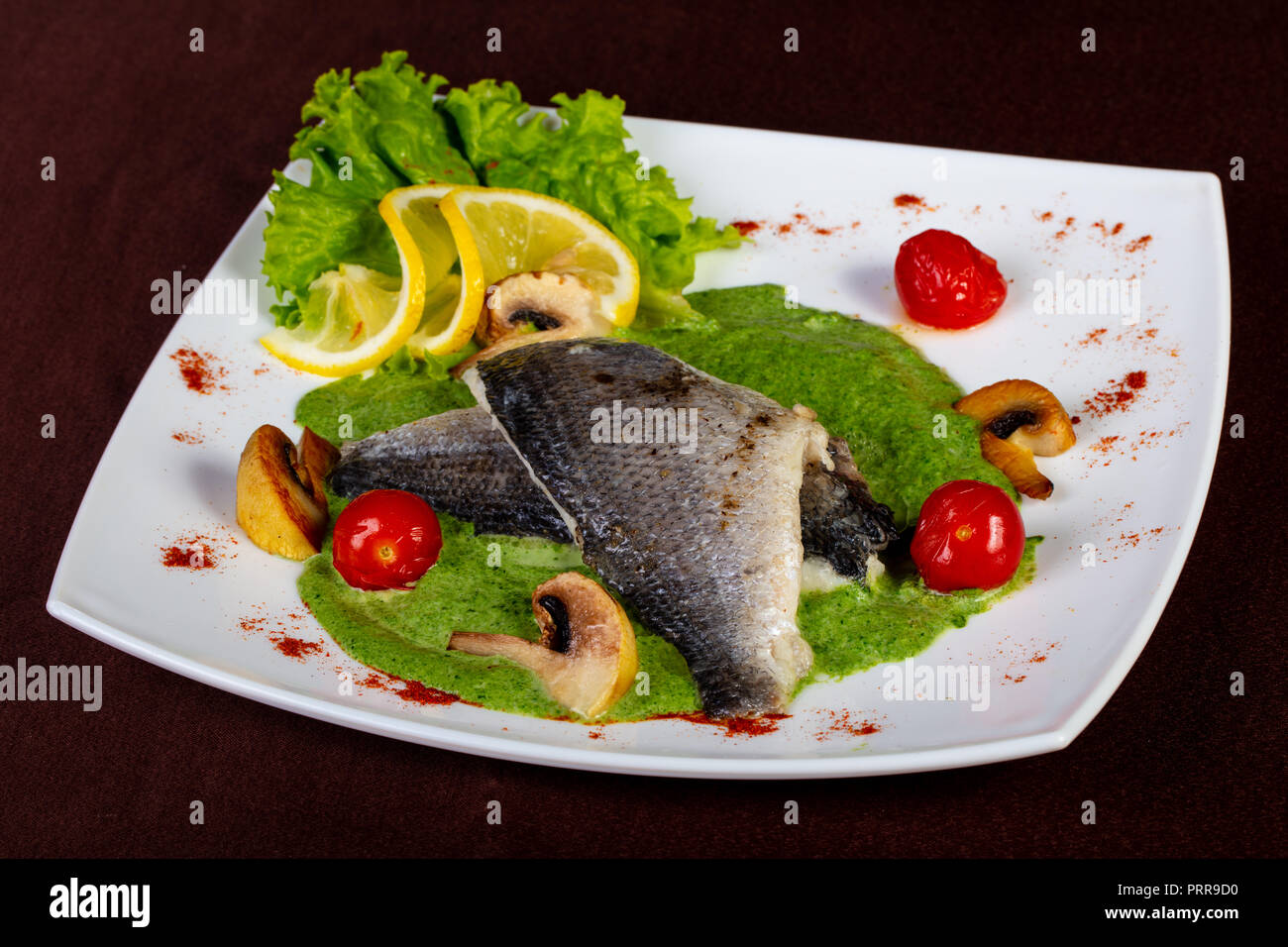 Steamed Dorada fish fillet with sauce Stock Photo - Alamy