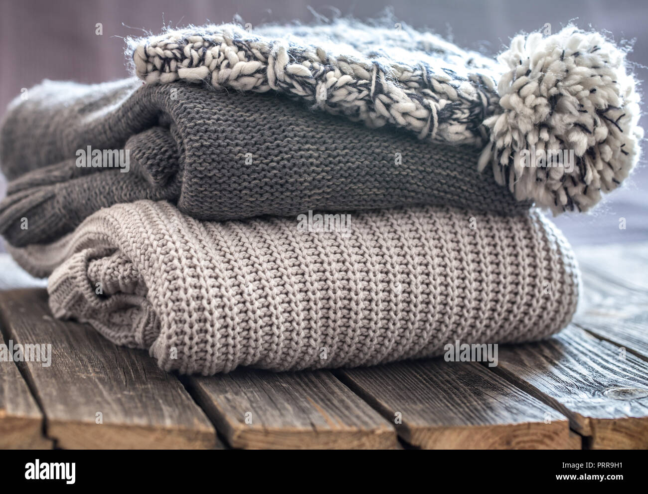 beautiful knitted clothes, neatly folded, close-up, handmade knitted ...