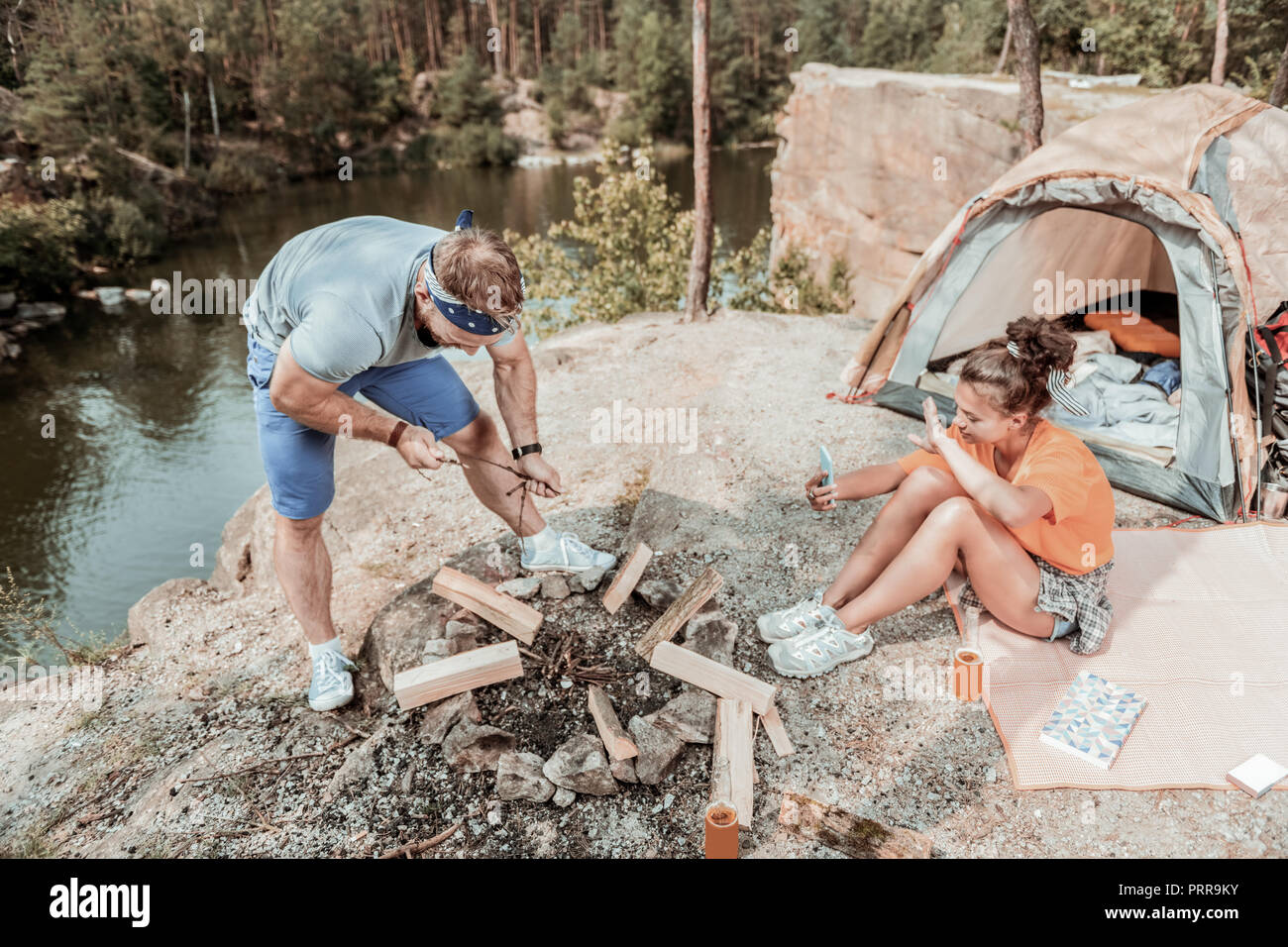 Camp start fire woman hi-res stock photography and images - Alamy
