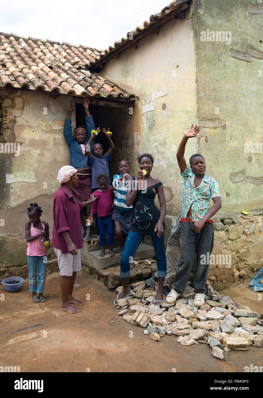 Angolan boys and girls in a village with mangoes, Huila Province ...