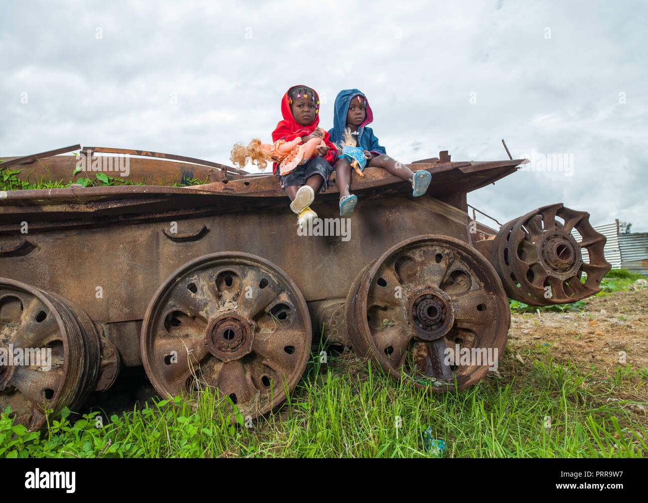 Angolan children playing on a tank wreck, Huambo Province, Huambo ...