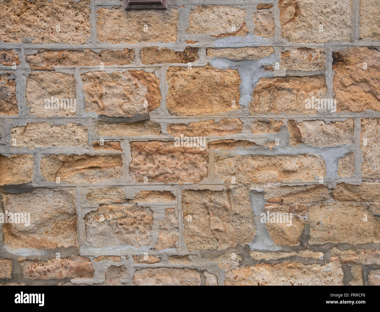 Old stone wall. Ageing sandstone wall showing signs of crumbling Stock ...