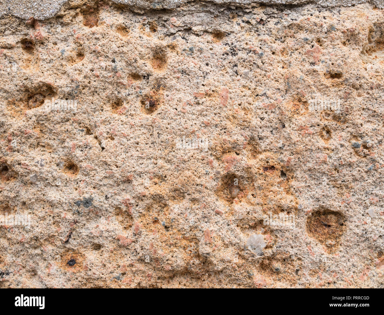 Ageing spongy sandstone wall showing signs of crumbling Stock Photo - Alamy