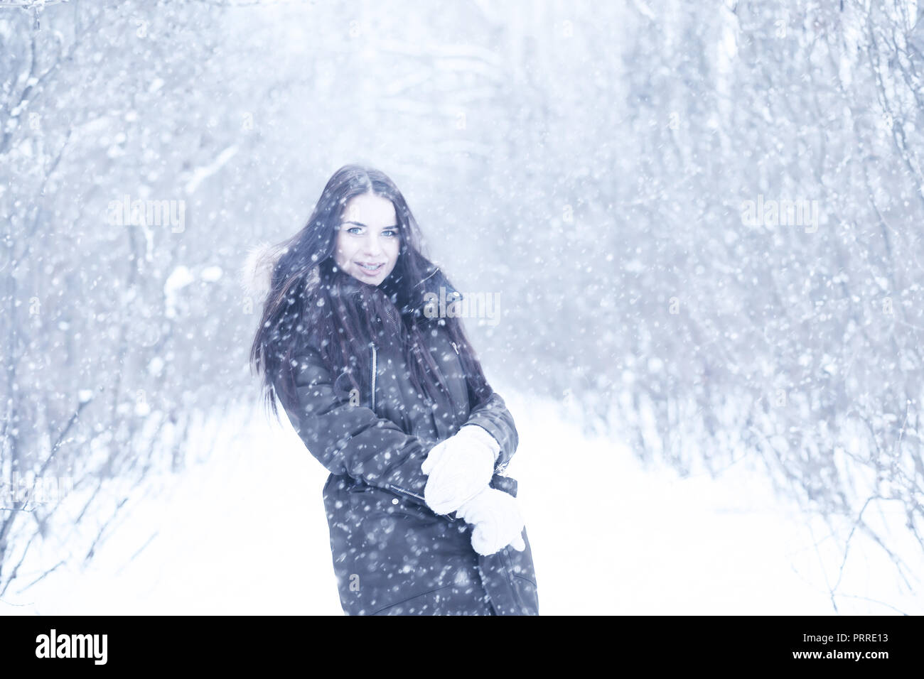 Beautiful girl in a beautiful winter snow Stock Photo - Alamy