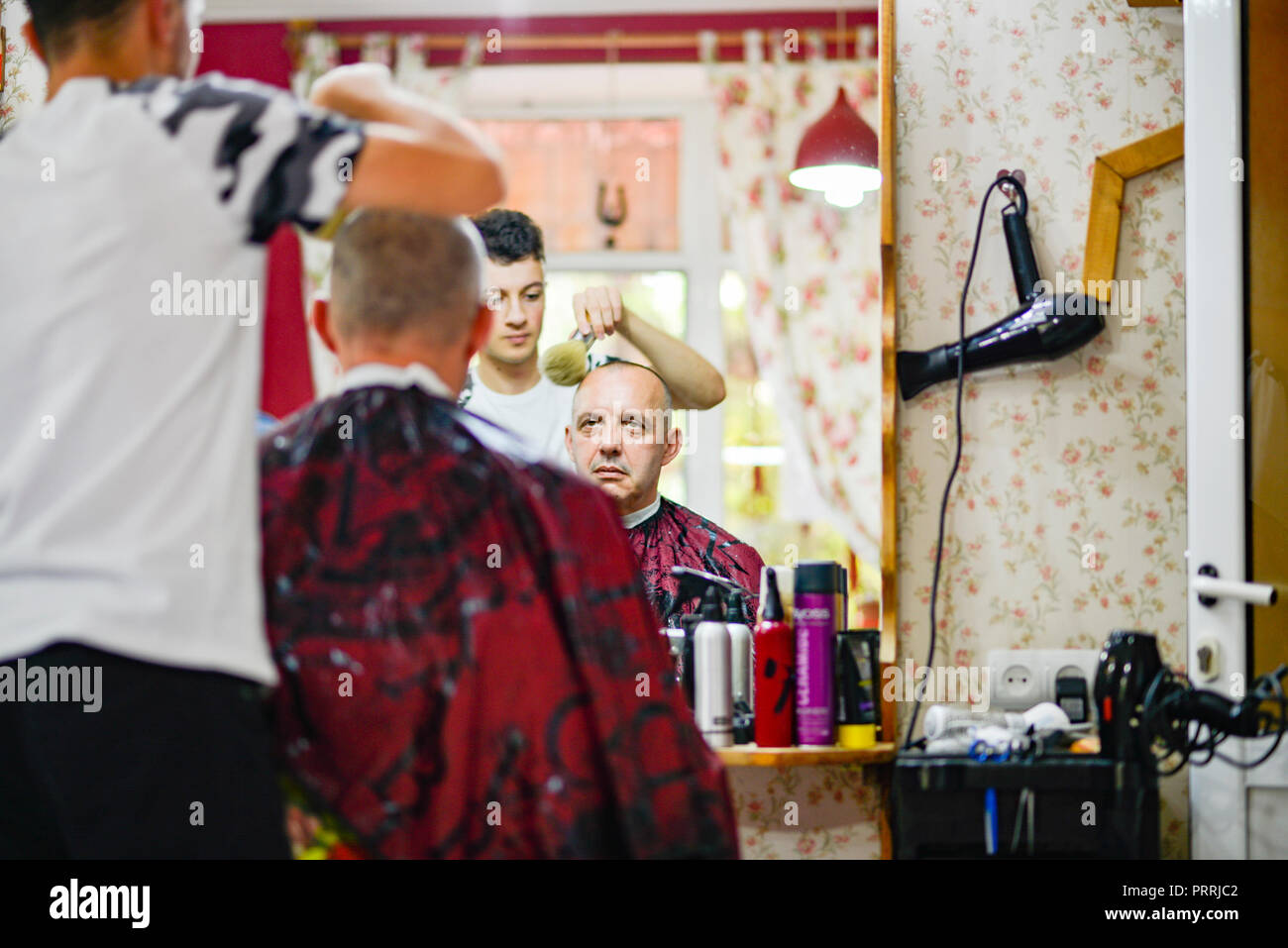 A visit to the barbershop for a close back and sides Stock Photo - Alamy