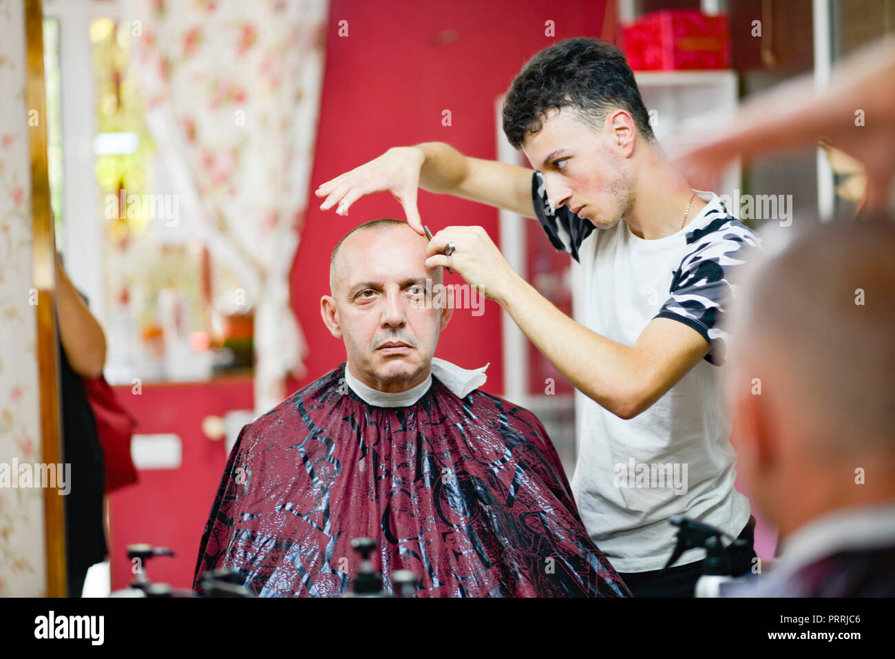 A visit to the barbershop for a close back and sides Stock Photo - Alamy