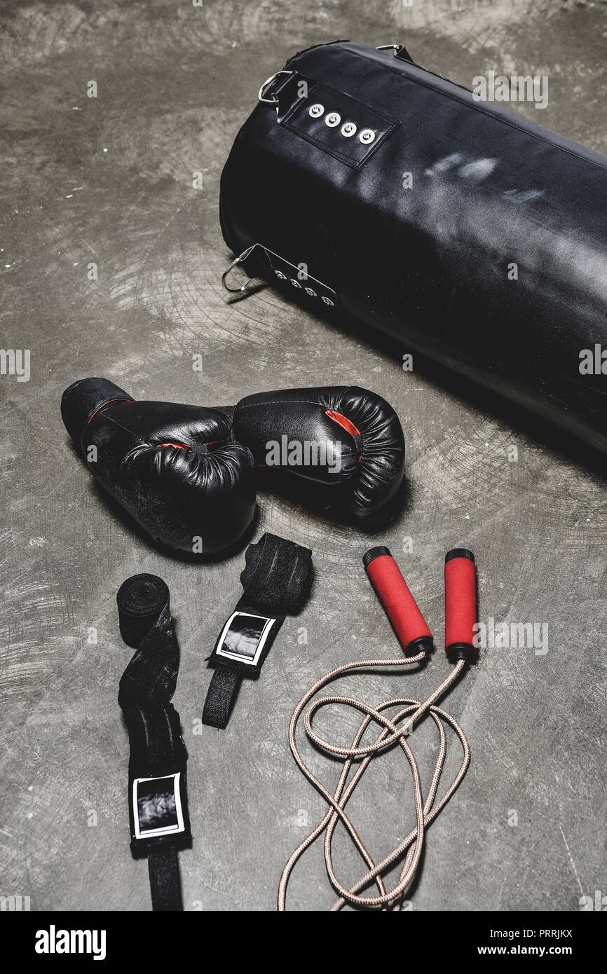 different boxing equipment lying on concrete surface Stock Photo - Alamy