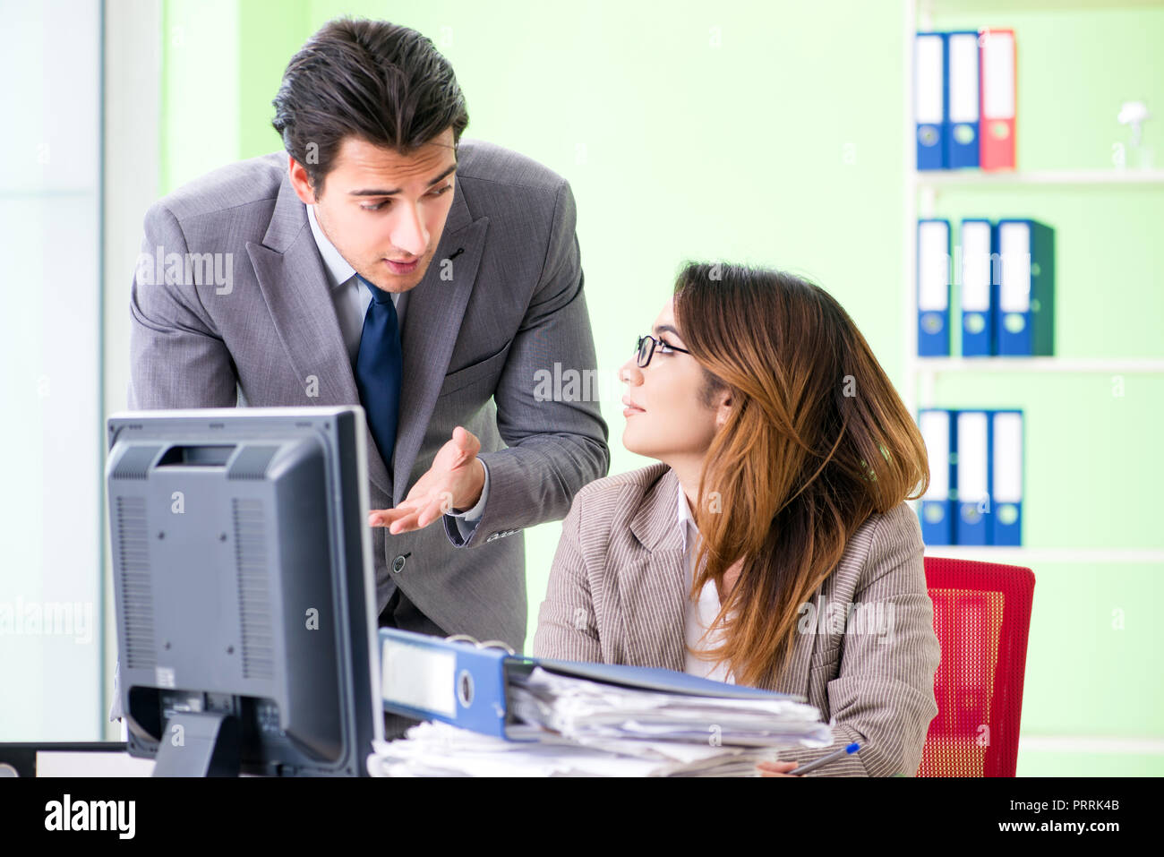 Two colleagues working in the office Stock Photo - Alamy