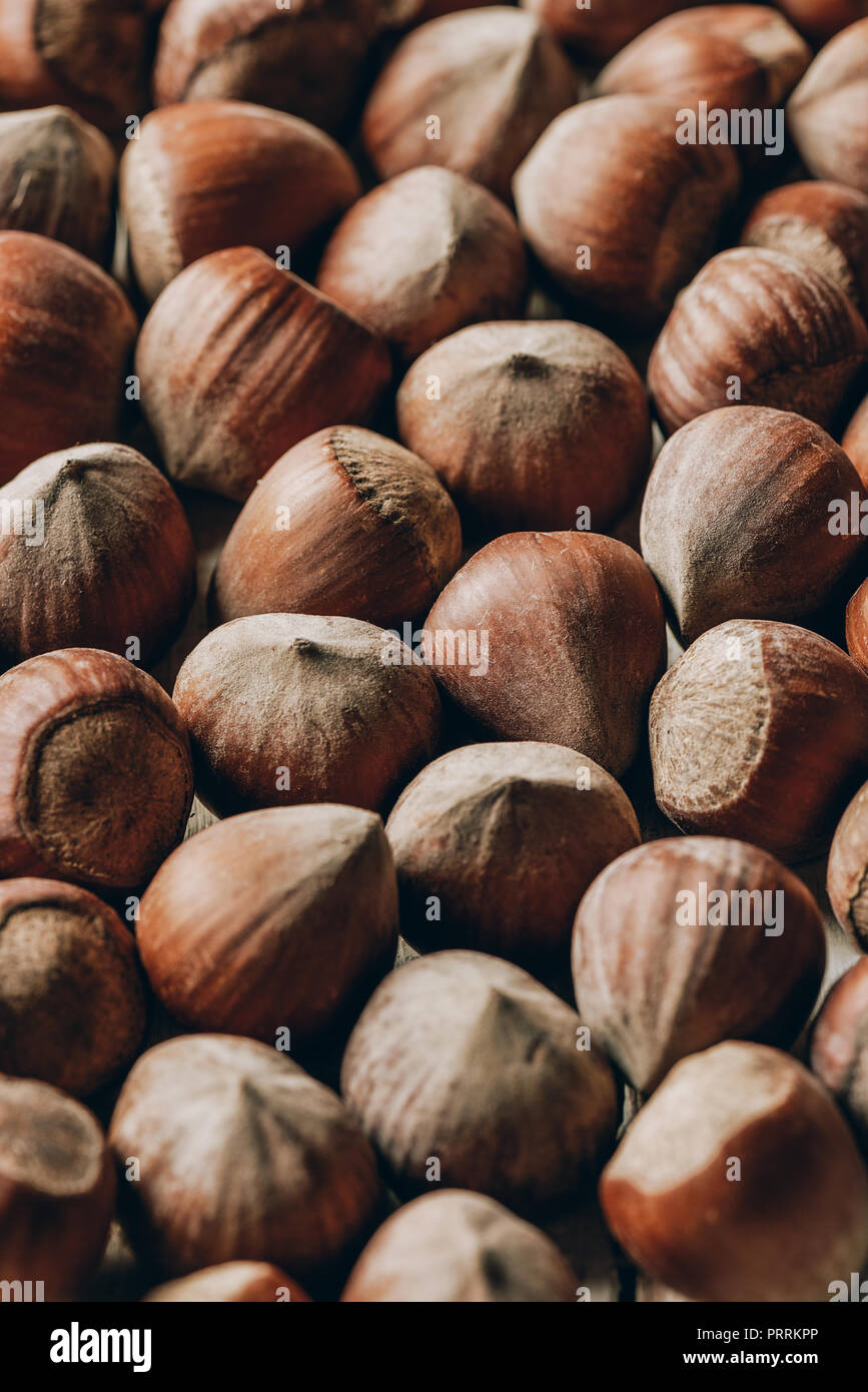 full frame view of raw ripe organic hazelnuts background Stock Photo ...