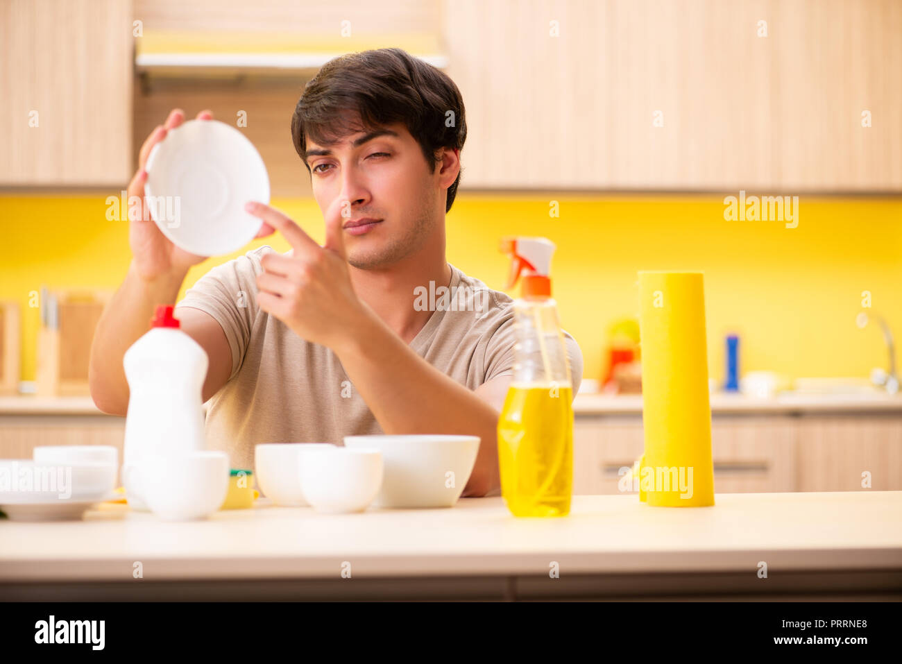 Man washing dishes at home Stock Photo - Alamy