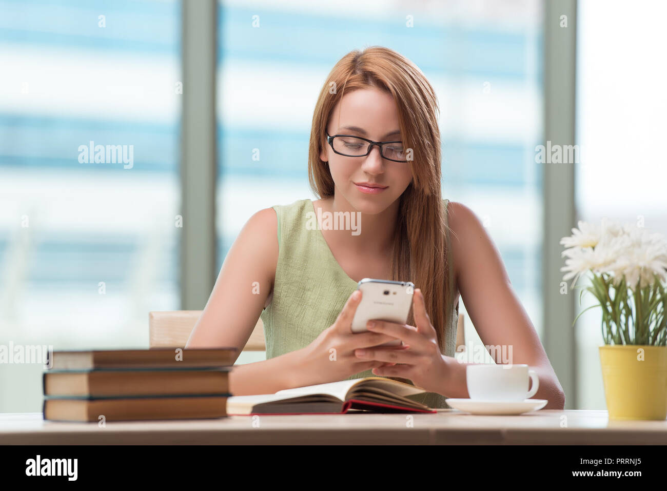 Young student preparing for exams drinking tea Stock Photo - Alamy