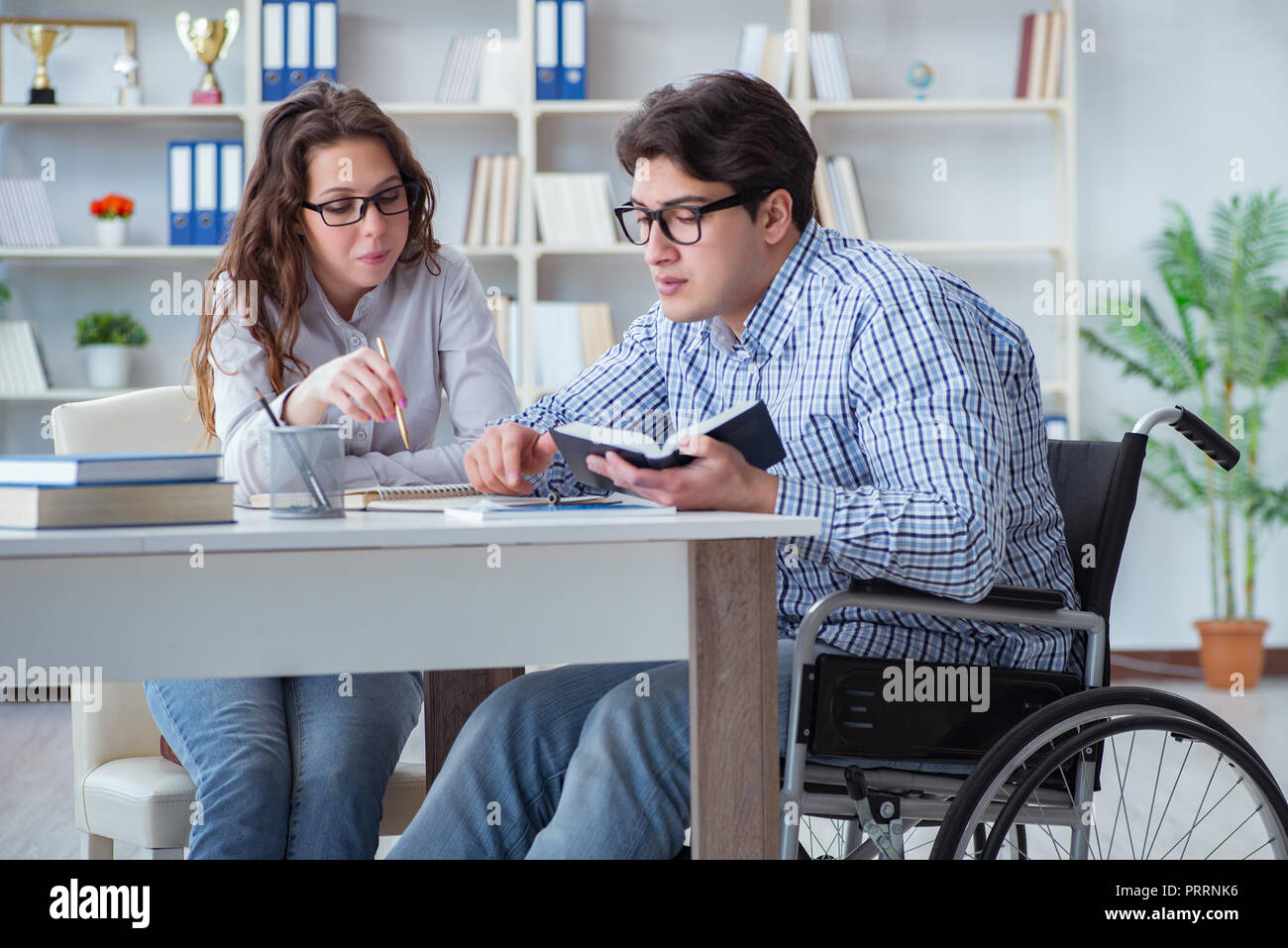 Disabled student studying and preparing for college exams Stock Photo ...